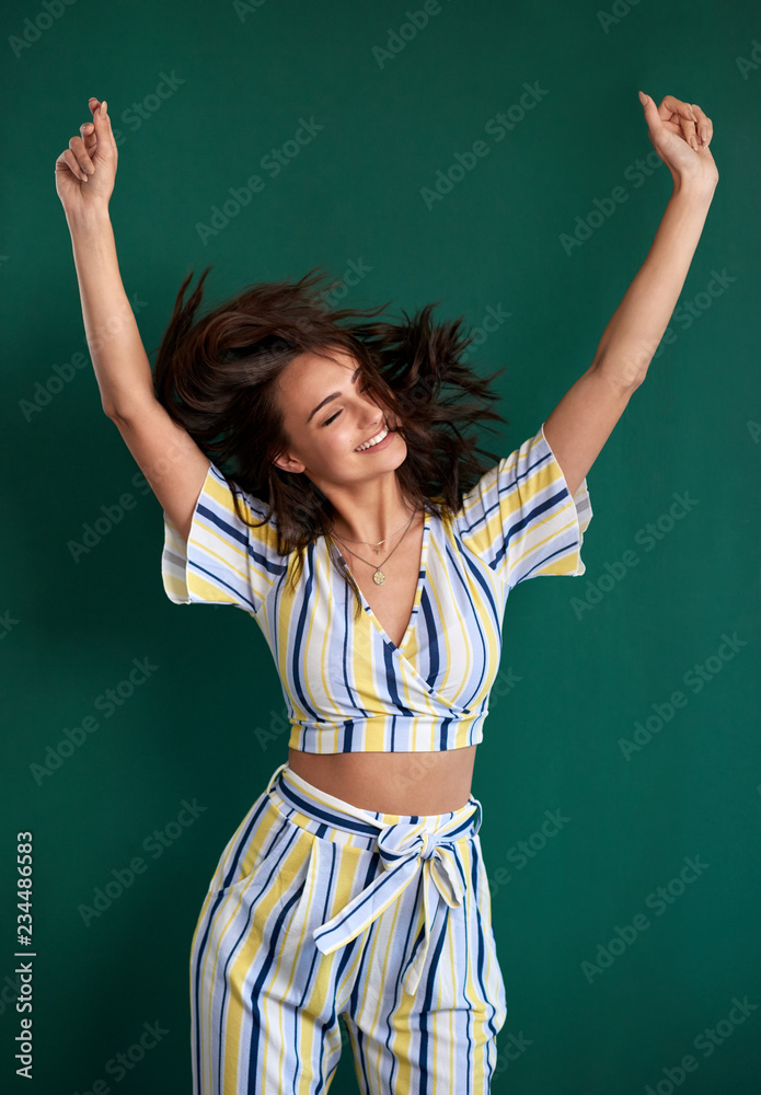 Happy woman dancing Stock Photo | Adobe Stock