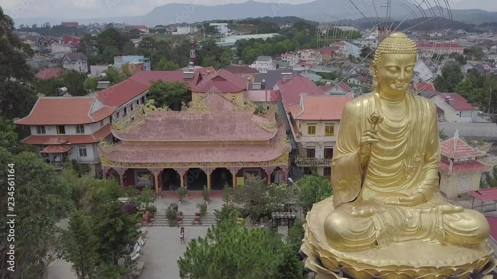 2K Aerial Close-up of the famous golden Buddha in Vietnam Da Lat. Old ...
