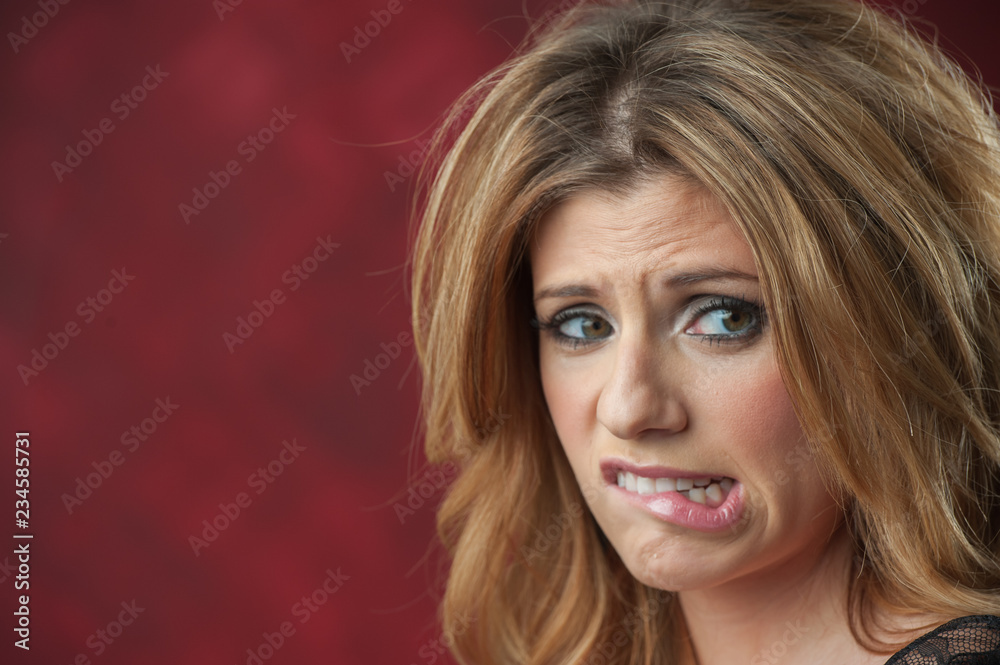 Young woman visibly uncomfortable facial expression Stock Photo | Adobe ...