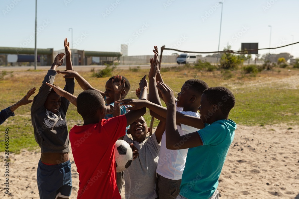 Kids forming hands stack in the ground Stock Photo | Adobe Stock