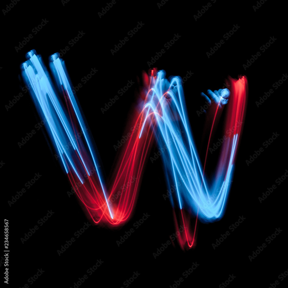 Letter W of the alphabet made from neon sign. The blue light image ...
