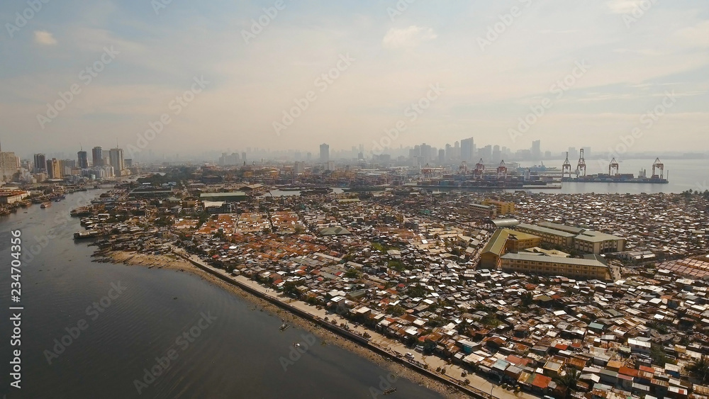 Aerial view poor district of Manila slums, ghettos, wooden old houses ...