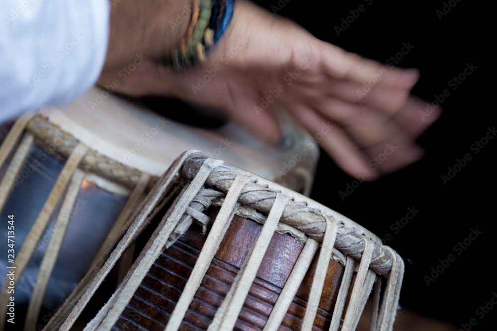 Images of a man's hands (wearing beads) playing the Tabla - Indian ...