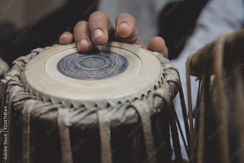 Images of a man's hands (wearing beads) playing the Tabla - Indian ...