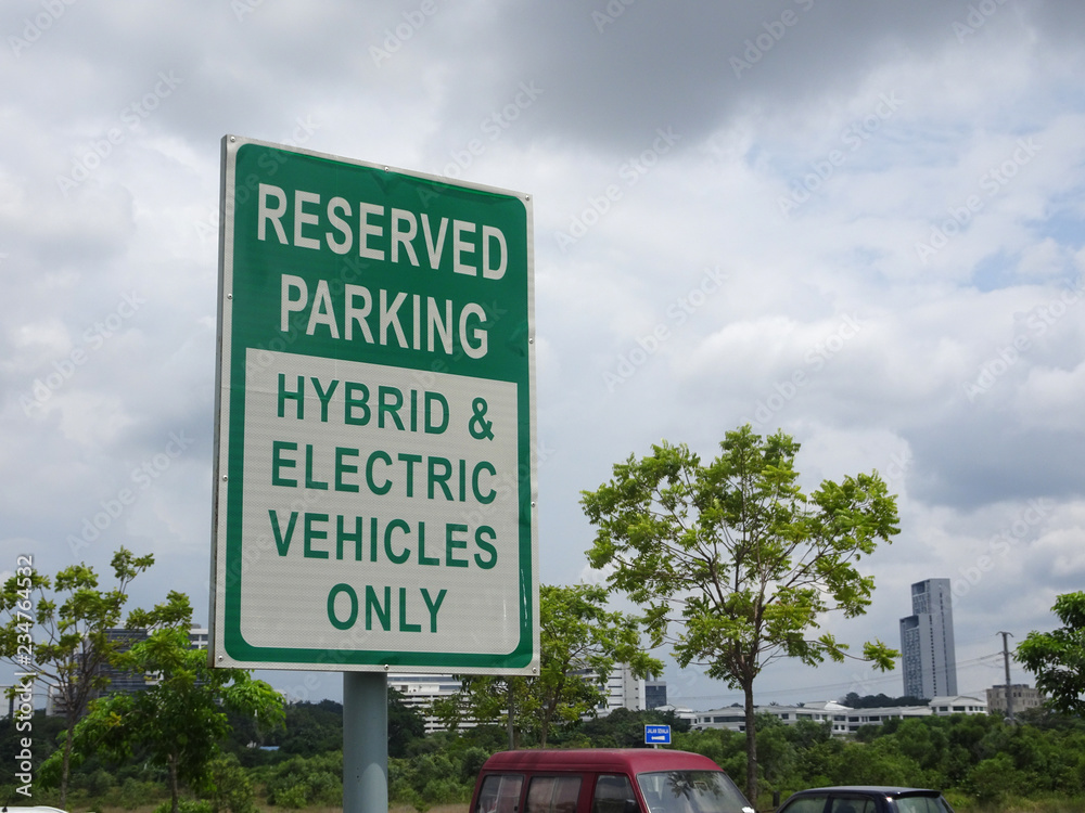 Signboard for car park lot for hybrid & electric vehicles only. Special ...