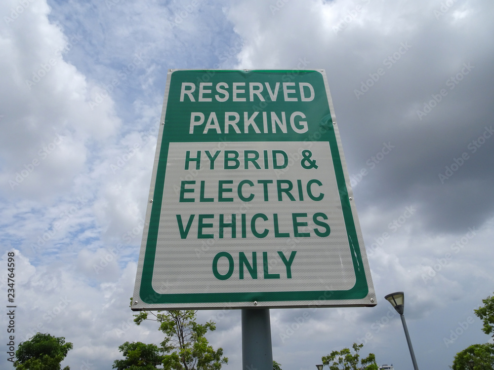 Signboard for car park lot for hybrid & electric vehicles only. Special ...
