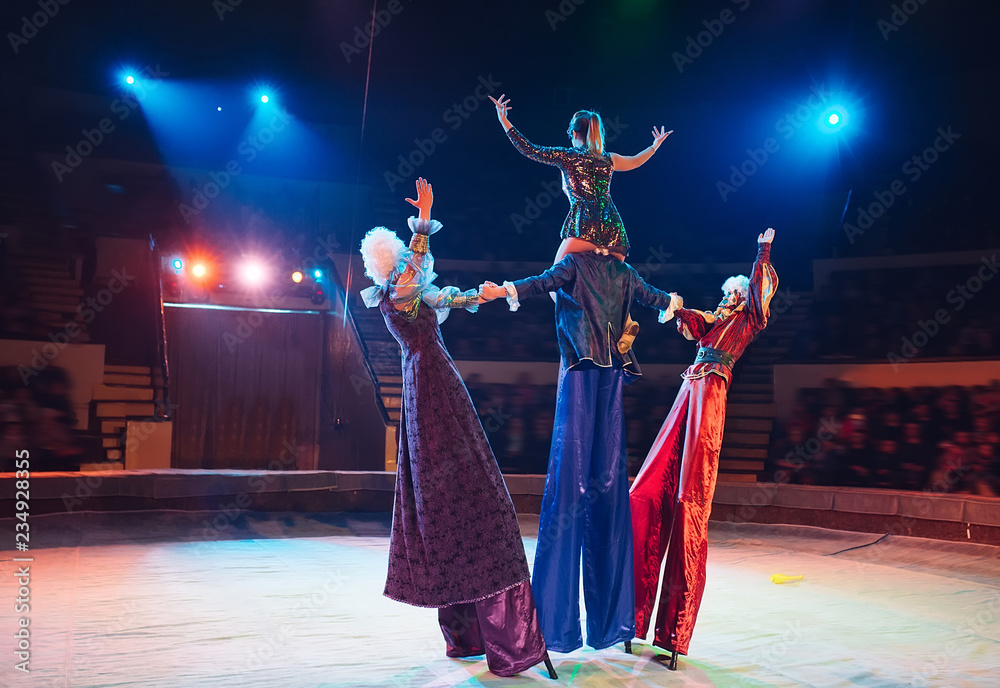 The performance of stilt-walkers in the circus. Stock Photo | Adobe Stock