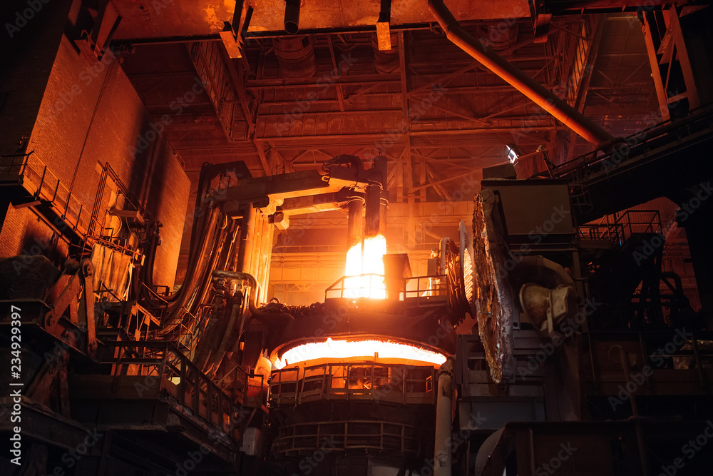Melting of metal in a steel plant. High temperature in the melting ...