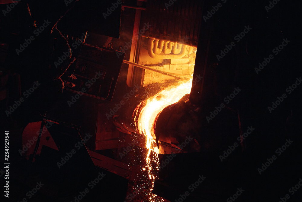 Melting of metal in a steel plant. High temperature in the melting ...