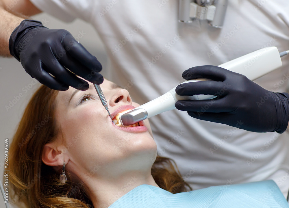 The dentist scans the patient's teeth with a 3d scanner. Stock Photo ...