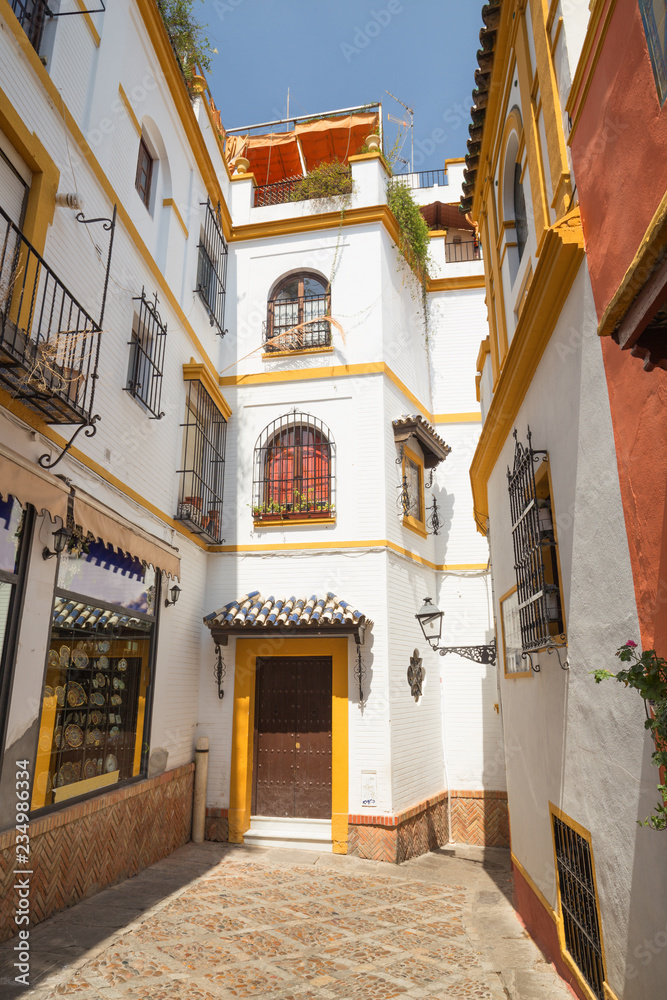Seville in Spain. Traditional colors of the city, white and yellow ...