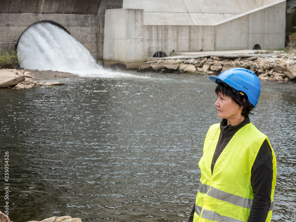 Dam and turbines of a hydroelectric power station with falling water ...