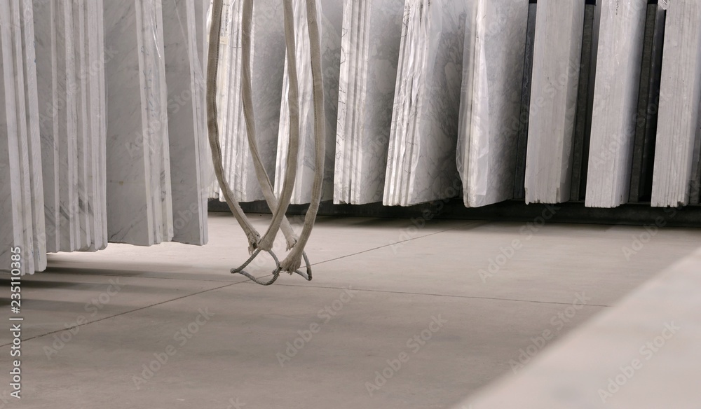 stack of marble slab with stainless steel rope for their lifting ...