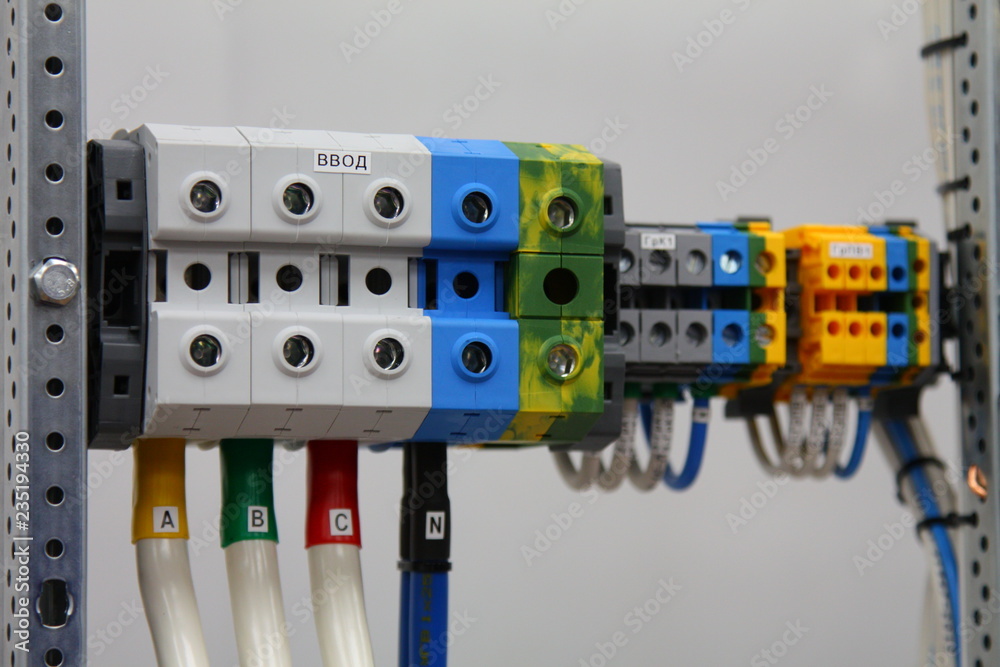 Connecting through-pass electrical terminals in the electrical panel ...