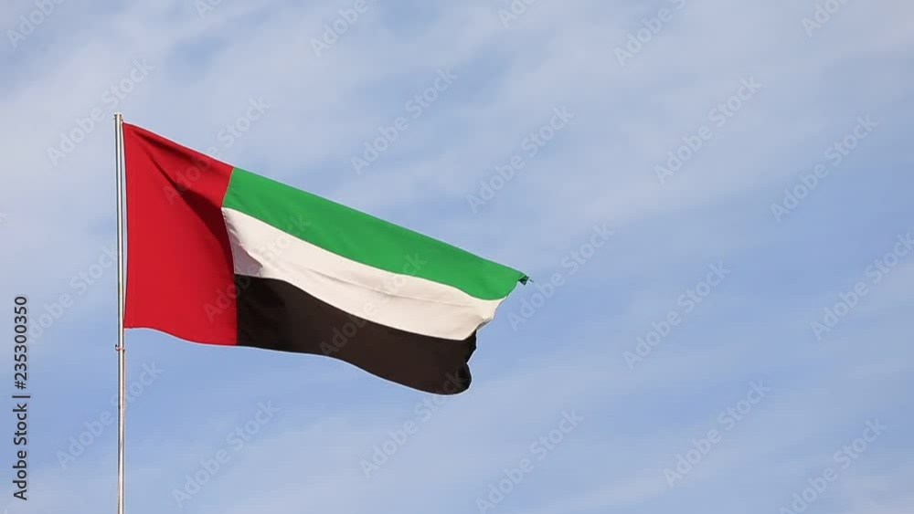 UAE flag waving in the sky, national symbol of UAE. UAE National Day ...