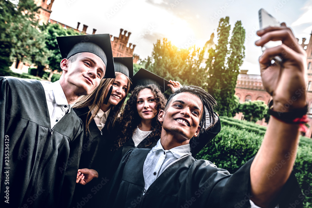 College was the best years of our lives! Group of young graduates ...