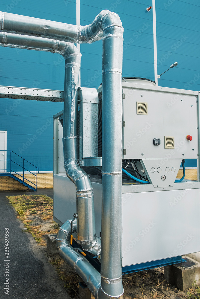 Industrial cooling unit for central ventilation system standing outside ...