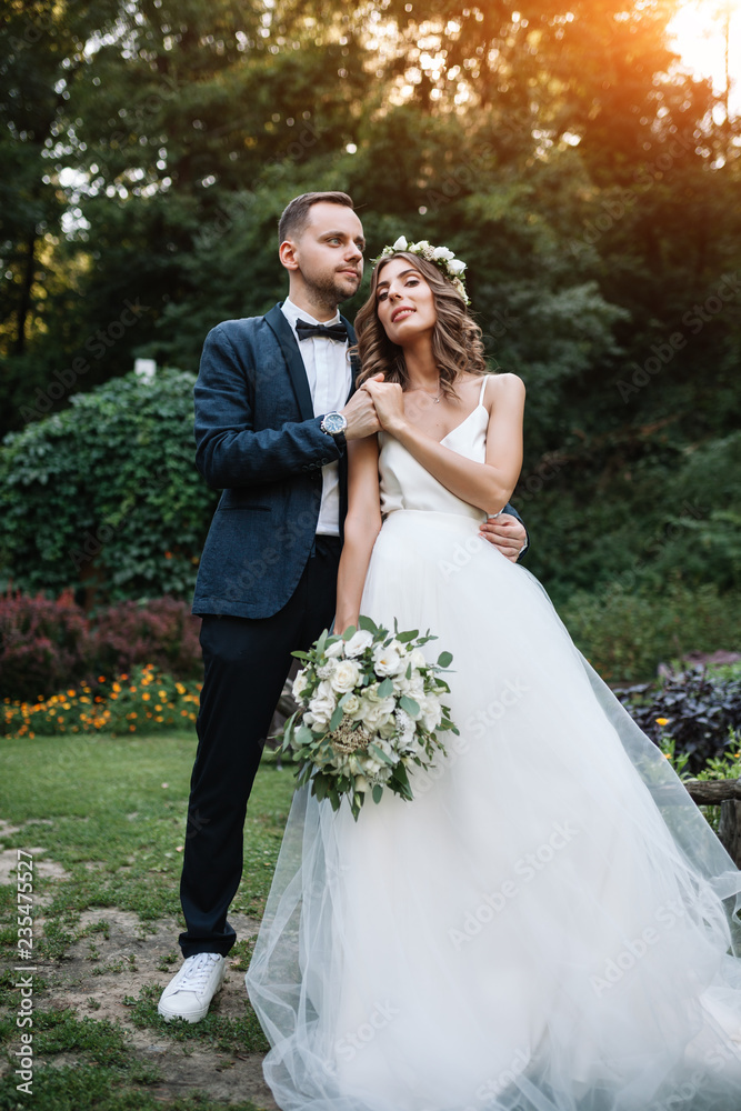 Bride and groom at wedding Day walking Outdoors on summer nature ...
