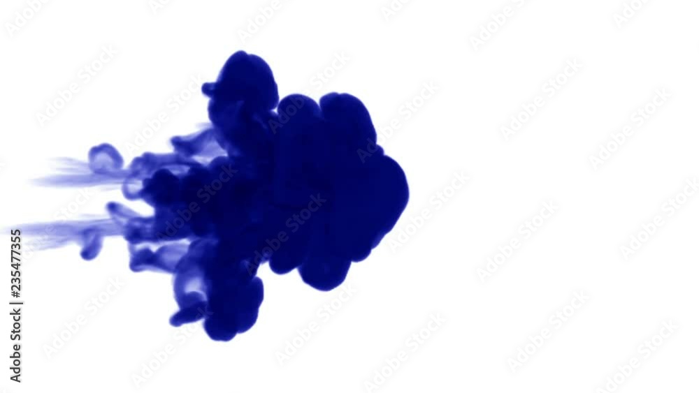 blue ink on a white background dissolves in water. beautiful effect ...