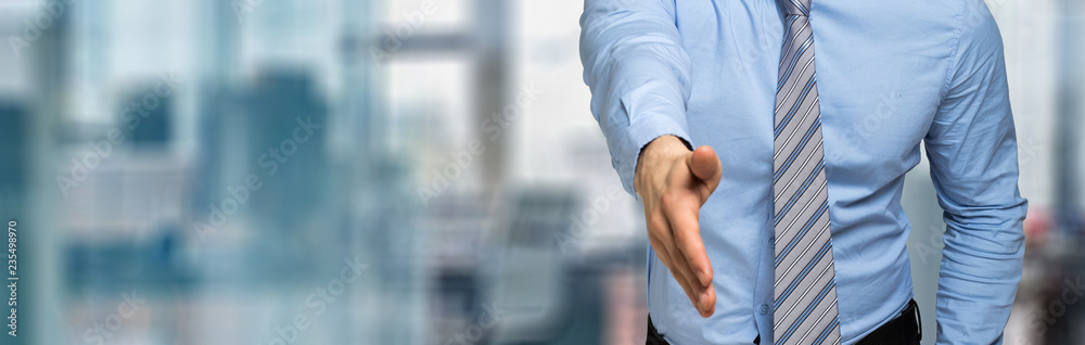 Young manager giving you a handshake Stock Photo | Adobe Stock