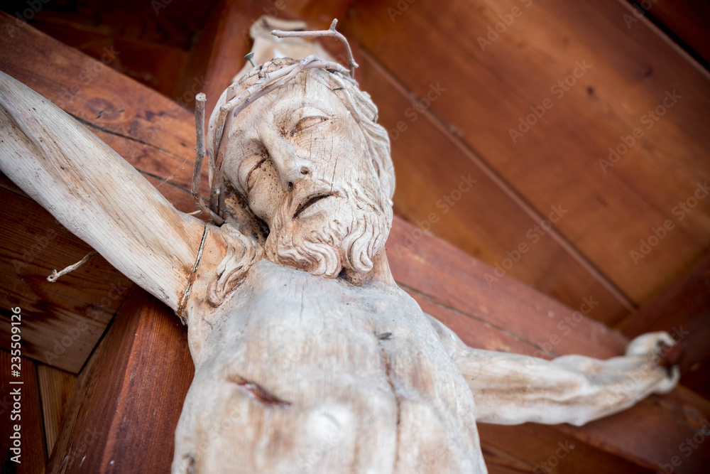 Holy Crucified Jesus Christ close-up. Ancient wooden sculpture. Stock Photo | Adobe Stock