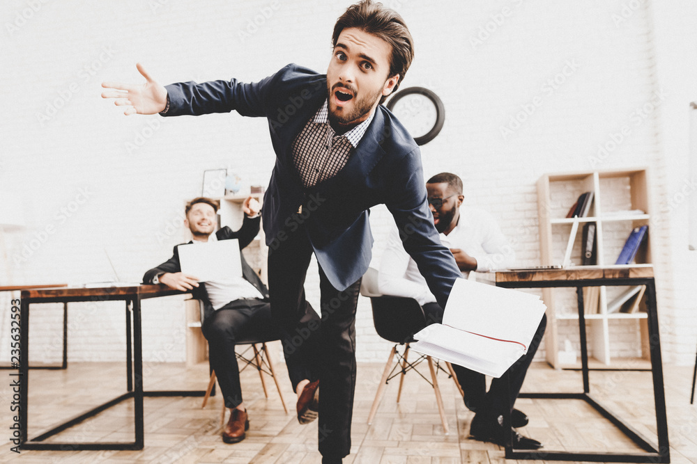Suprized Young Man Kicked by Colleagues in Office. Stock Photo | Adobe ...