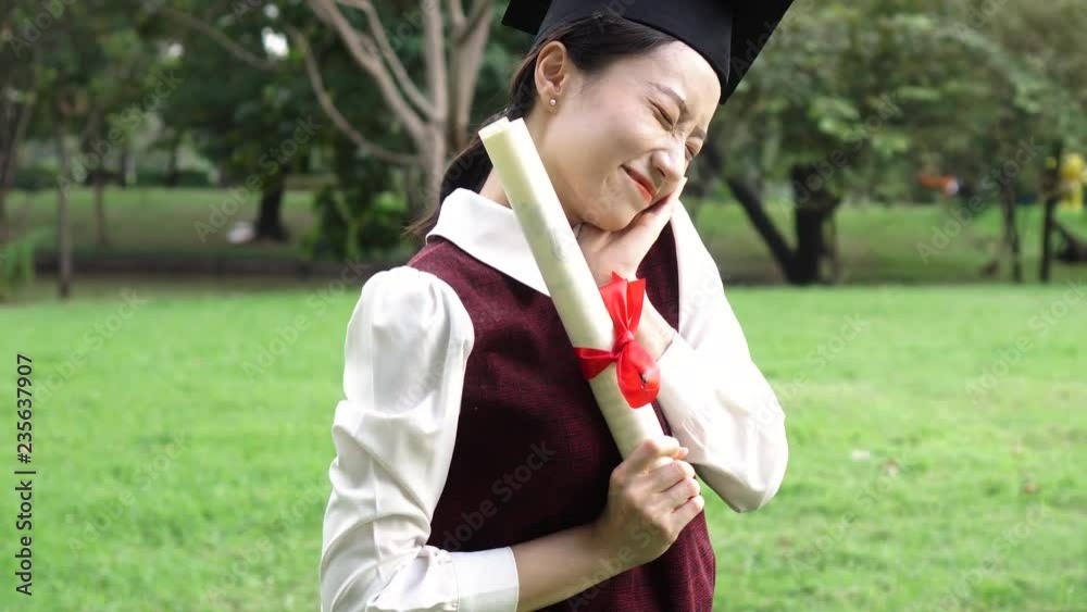 Young attractive Asian woman new graduate in school uniform pose for ...