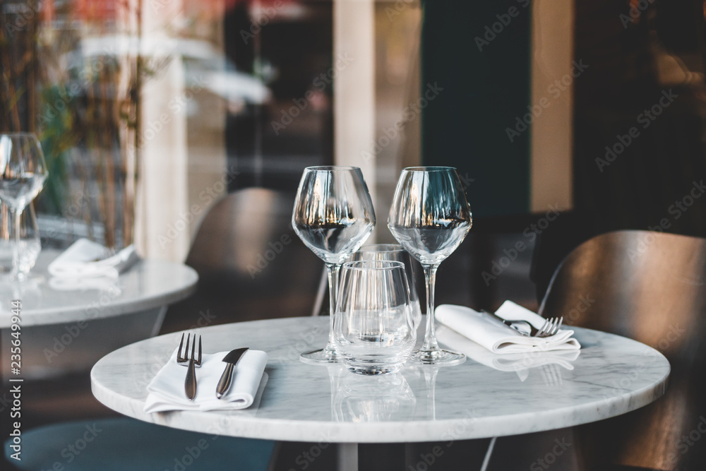 Table setting in a French restaurant. View through a window from a ...