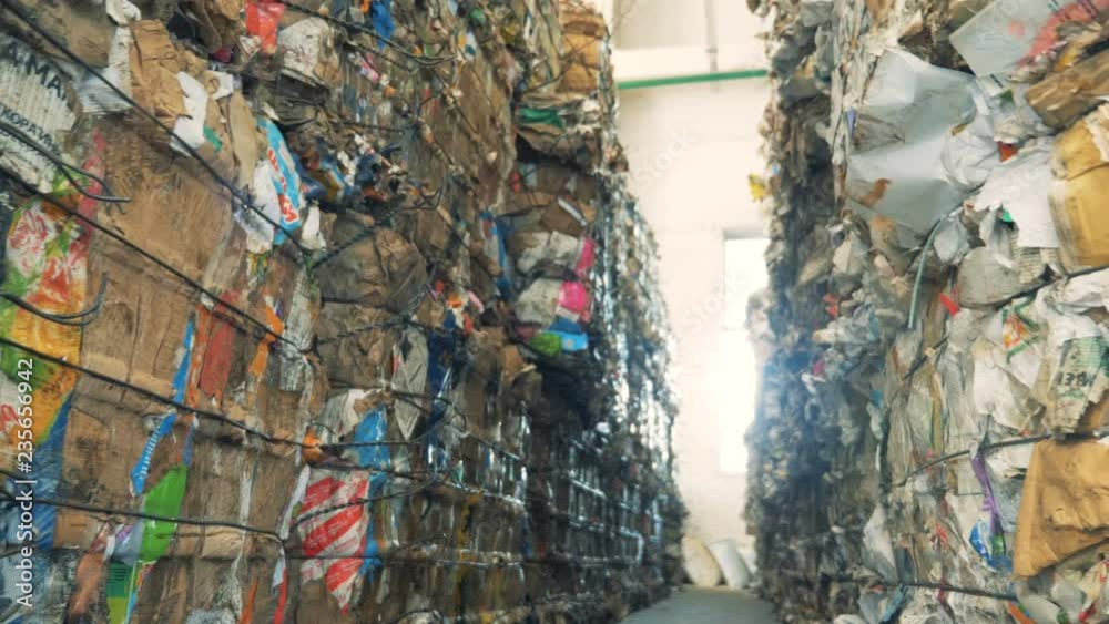 Long stacks of trash, close up. Discarded cardboard garbage on a ...