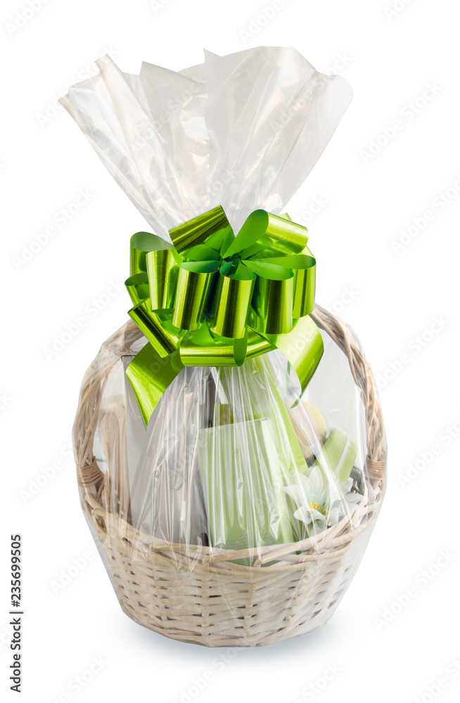 gift basket, hamper packed in transparent paper with a big green bow ...