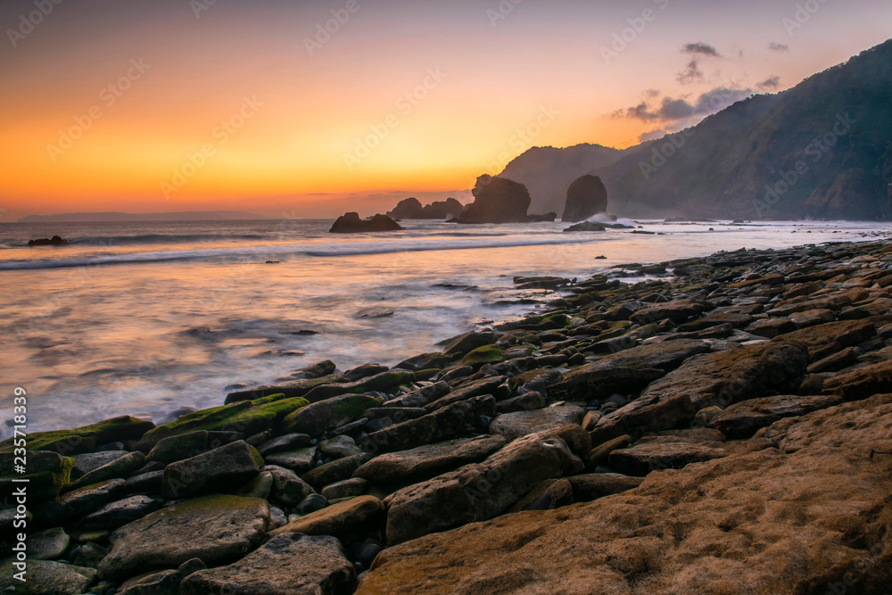 Tanjung Papuma Beach is a stretch of land to the sea with white sand ...