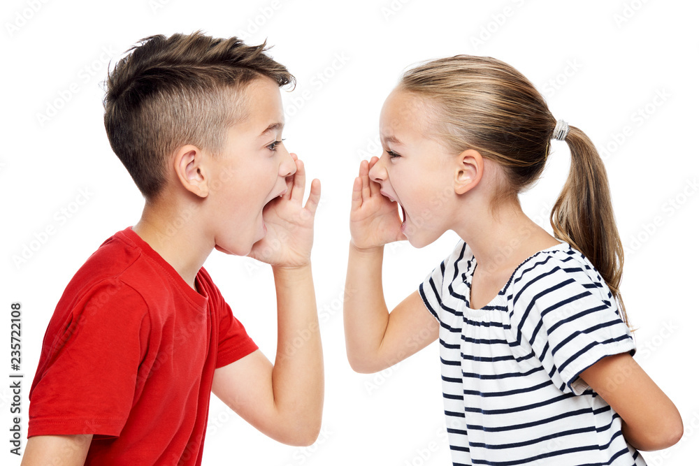 Young children facing eachother and shouting. Speech therapy concept ...