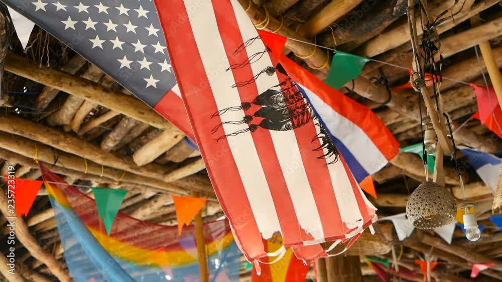 Decorative national flags of different countries hanging on strings in ...