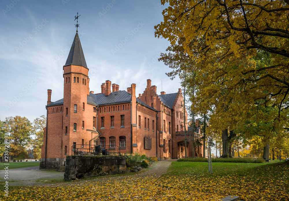Old red brick manor house in the style of English castles. Sangaste ...