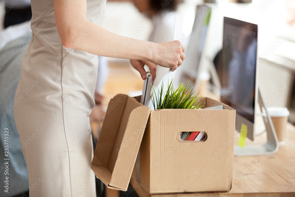 New female employee, trainee, intern unpacking box with belongings at ...