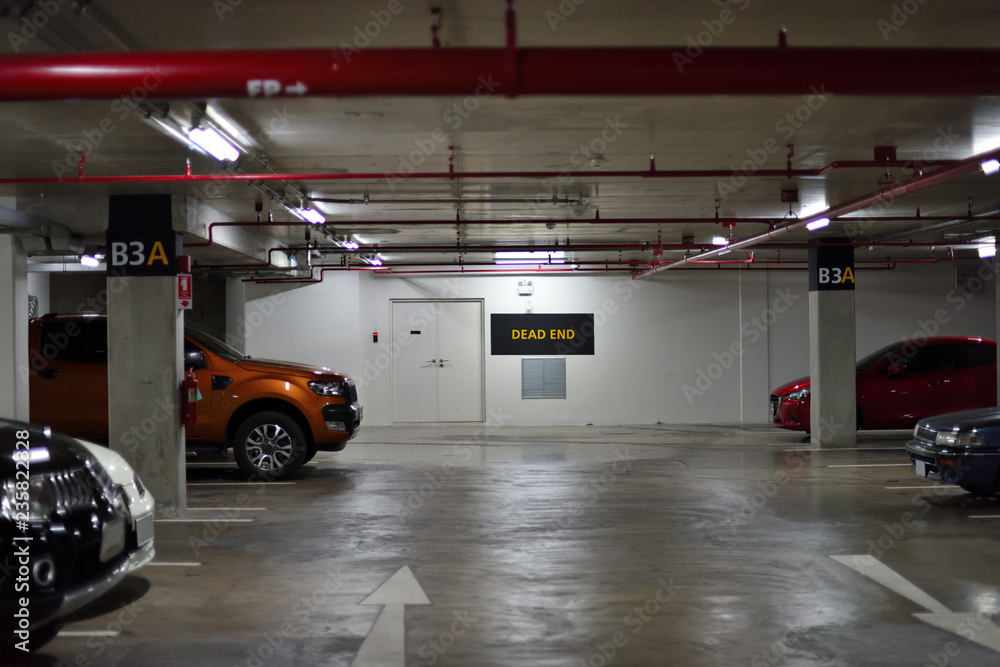 Basement interior undrerground parking lot in a modern building with ...