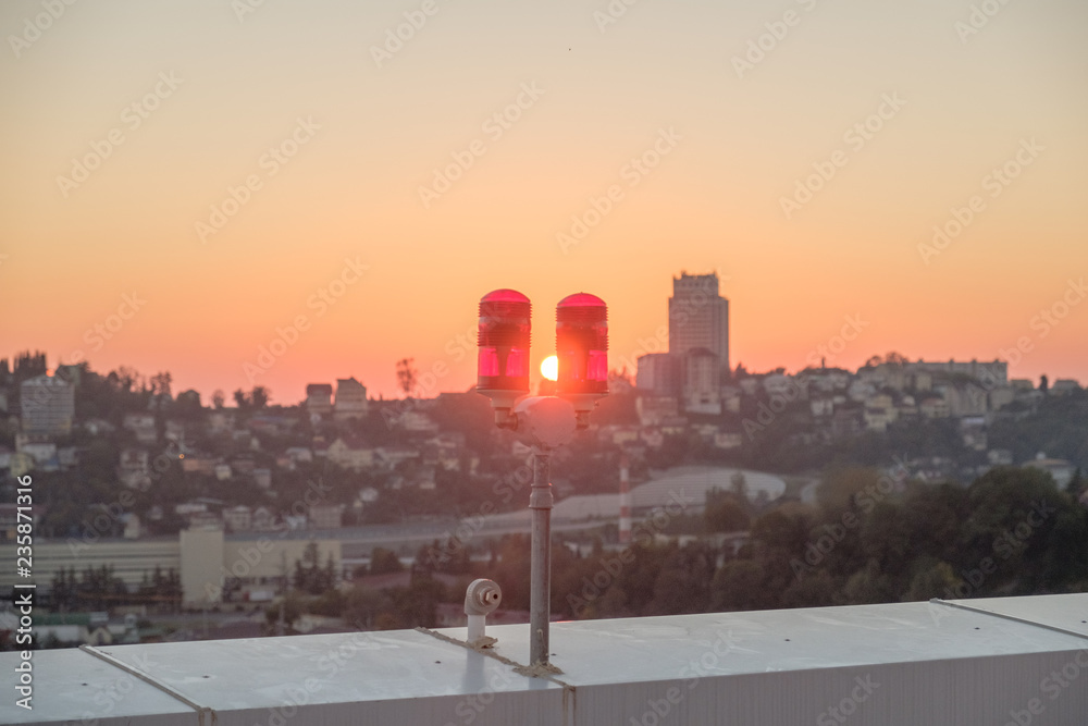red lights on the roof of a high-rise building for the safety of ...