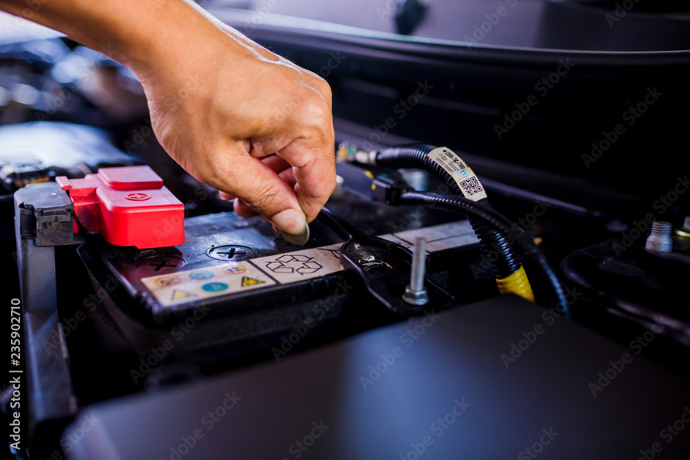 Check and maintenance the battery in car with yourself. Stock Photo ...
