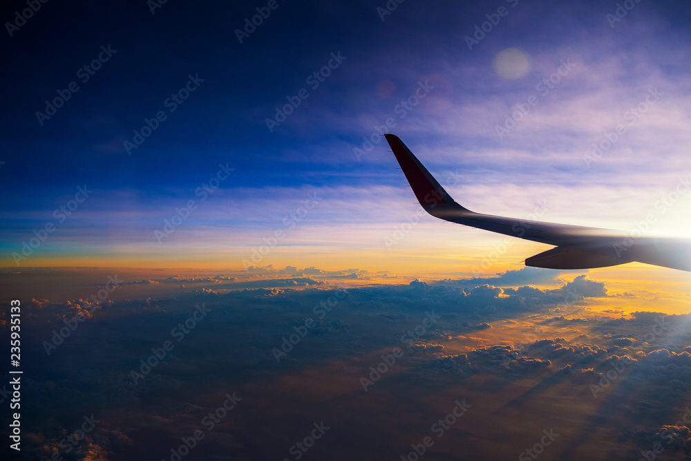 Sunrise sky with wing from window of airplane Stock Photo | Adobe Stock