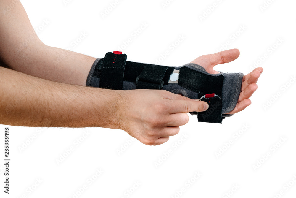Putting on an orthosis on a white background. Protective orthosis ...