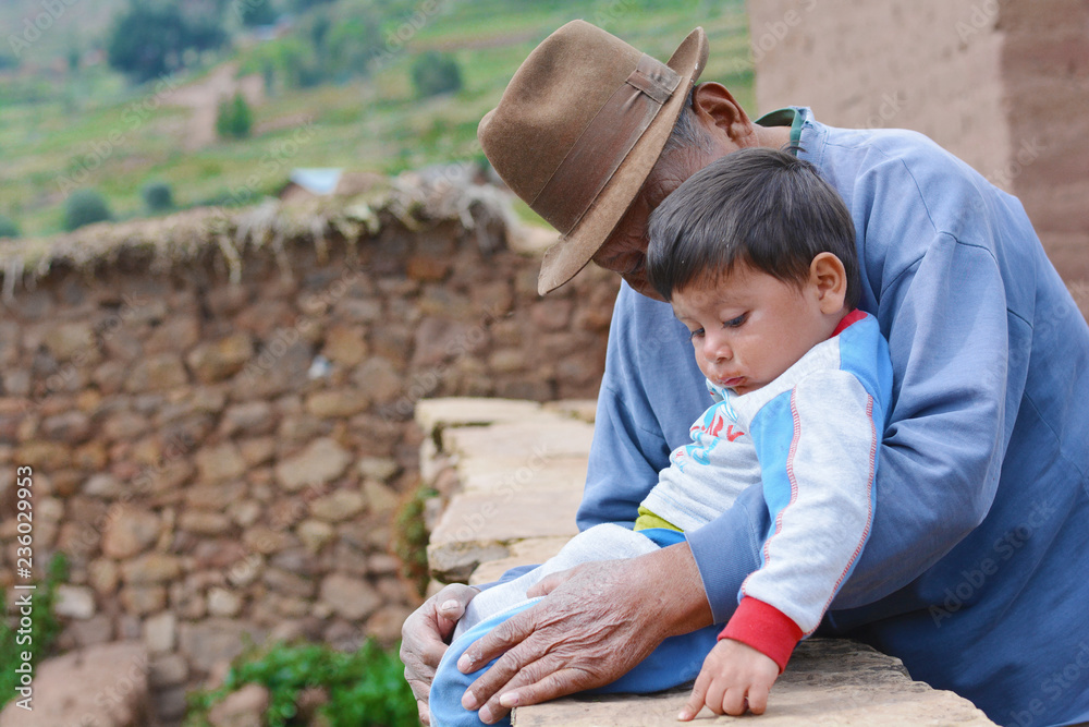 Native american grandfather hugging his grandchild outside. Stock Photo ...