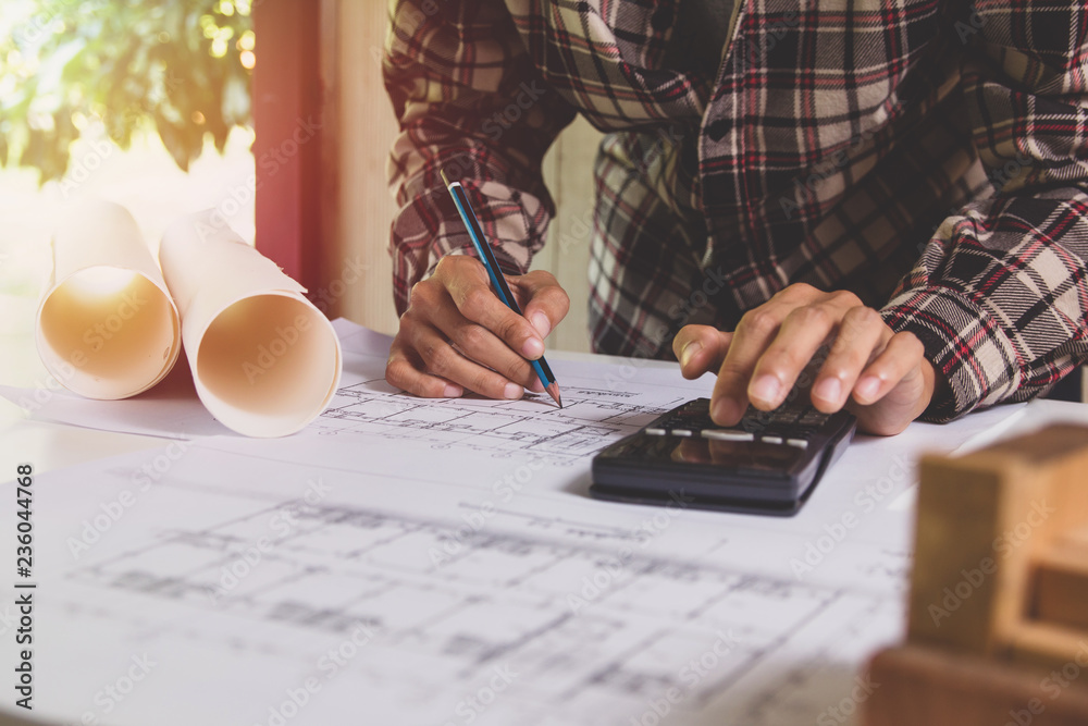 Concept architects, Hand of asian young man engineer using calculator ...