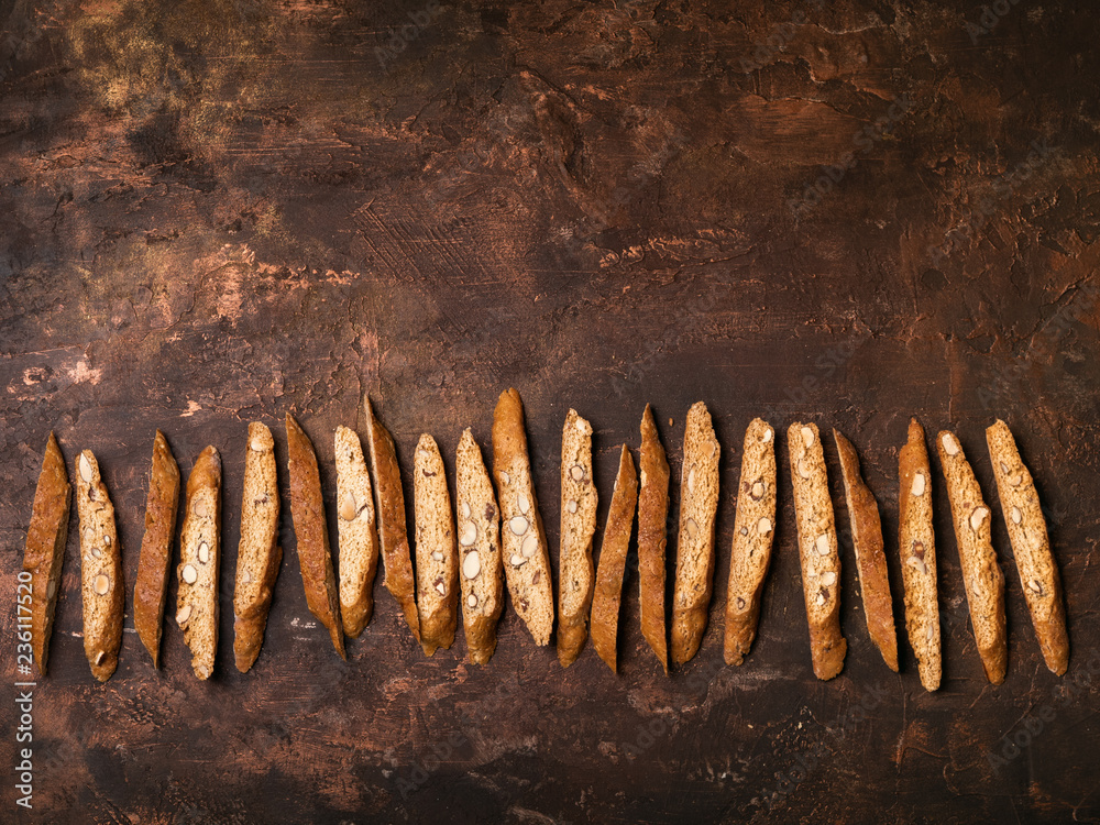 Biscotti - traditional Italian almond dessert on dark copper background ...
