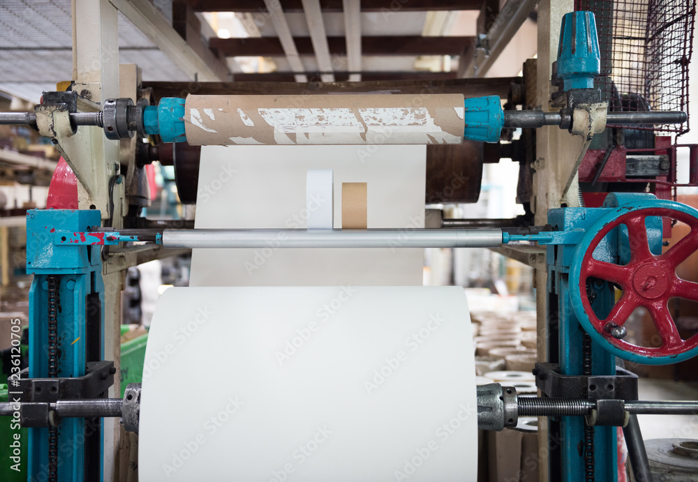 An empty quiet industrial wallpaper and paint factory with giant ...