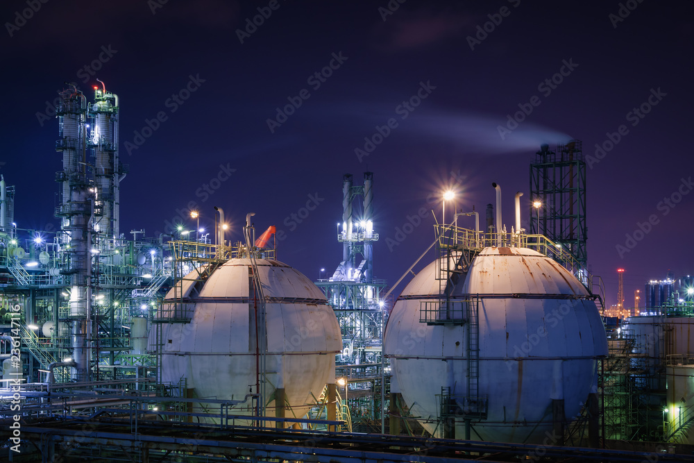 Storage sphere tanks in oil and gas refinery plant with night, Glitter ...