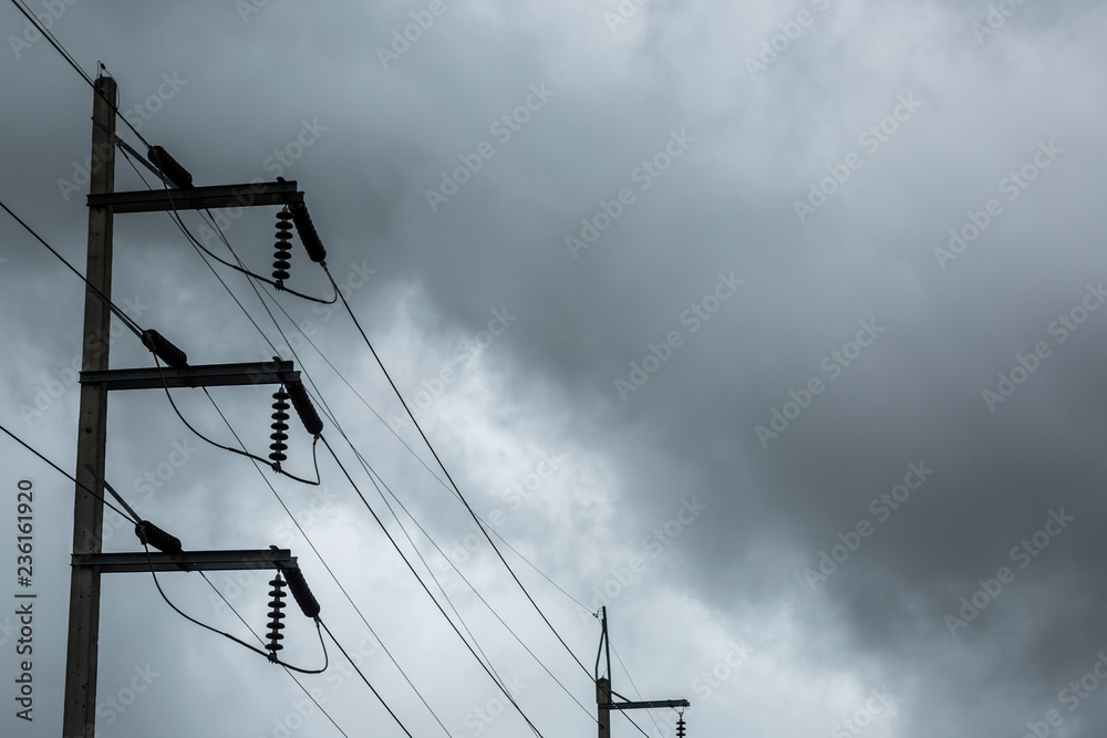 Electricity pole and high voltage power lines on the road with cloud ...