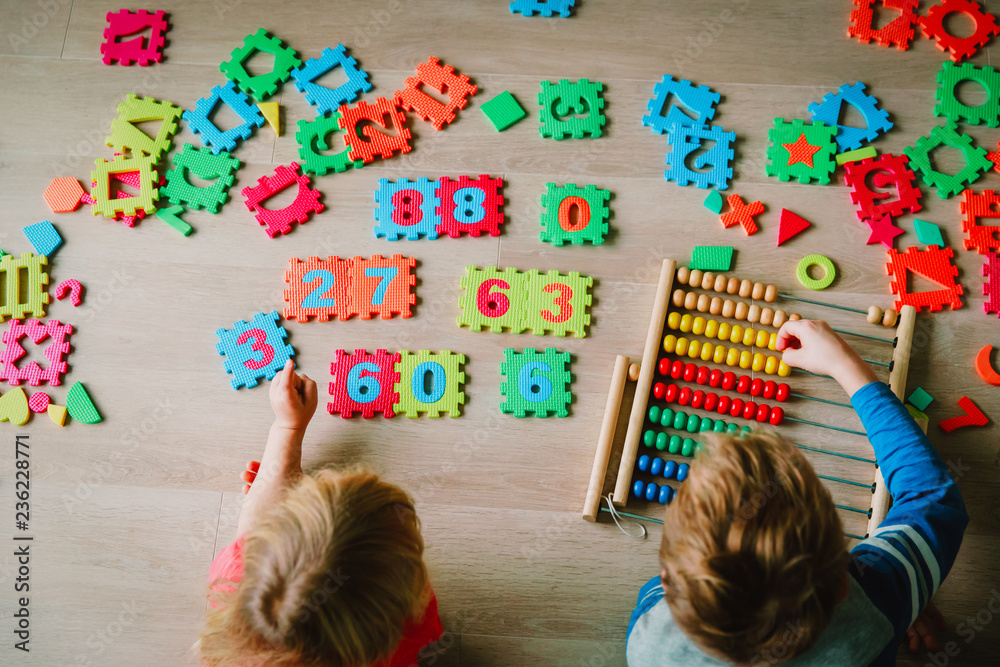 little boy and girl learn to calculate numbers Stock Photo | Adobe Stock
