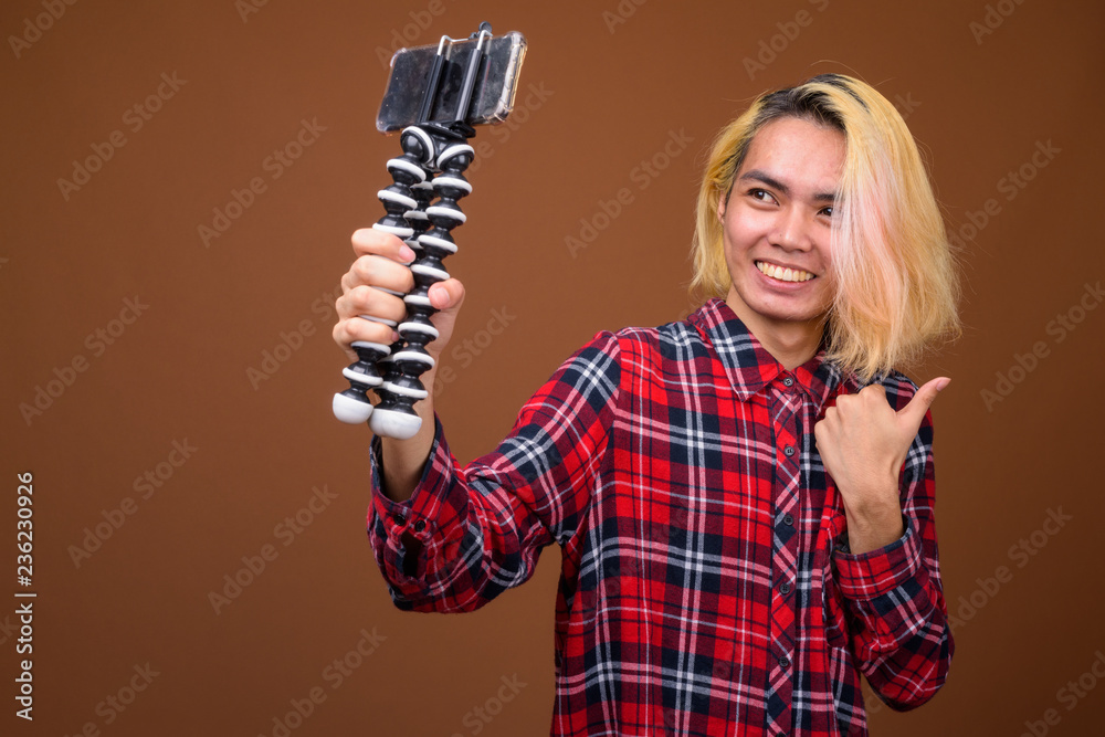 Young Asian Filipino man influencer vlogging in studio Stock Photo ...