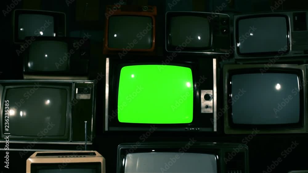 80S Tvs With Green Screen. Dolly Shot. Blue Steel Tone.You can replace ...
