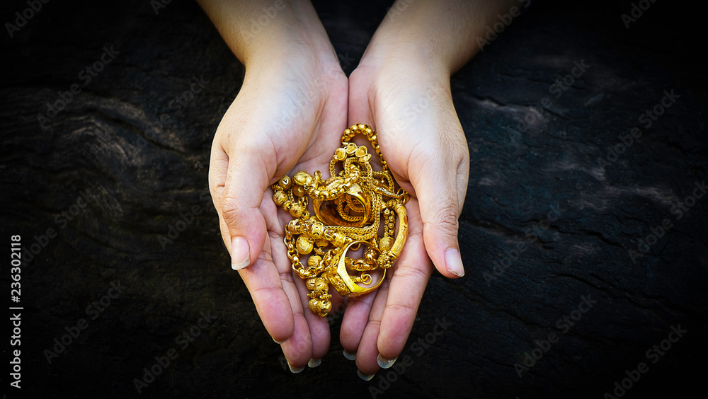 gold jewelry in lady hands,accessory and fashion Stock Photo | Adobe Stock
